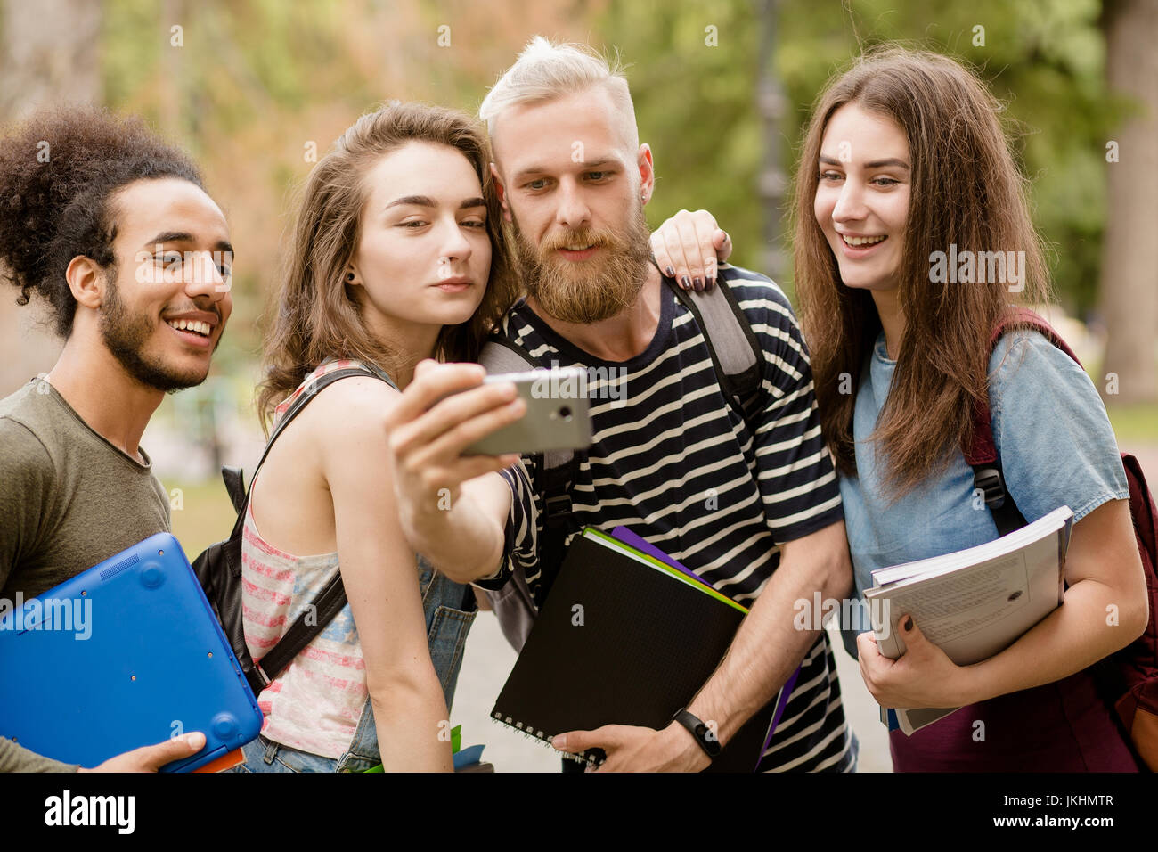 Four students making selfie shots Stock Photo - Alamy