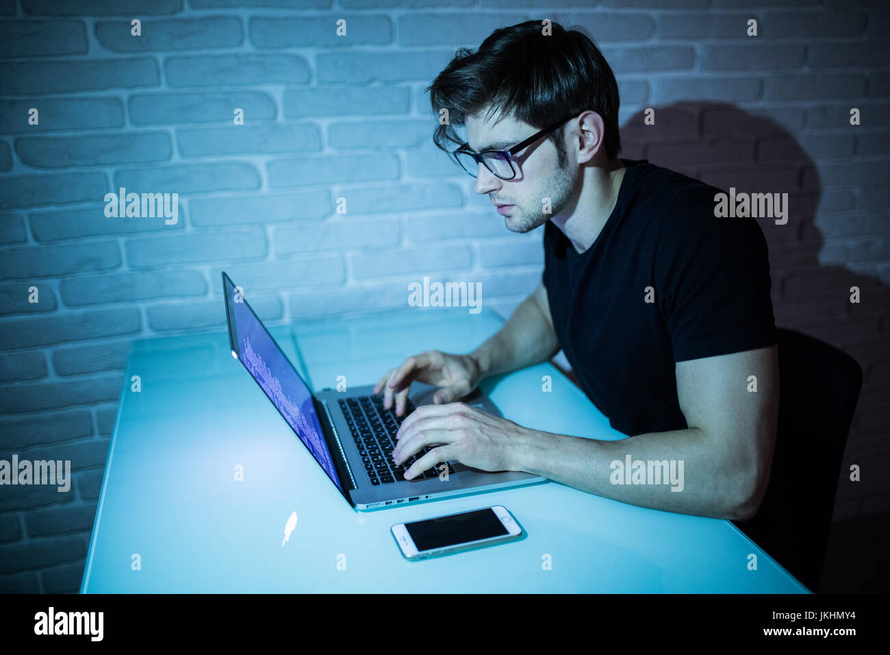 Program development concept young man working with computer Stock Photo ...