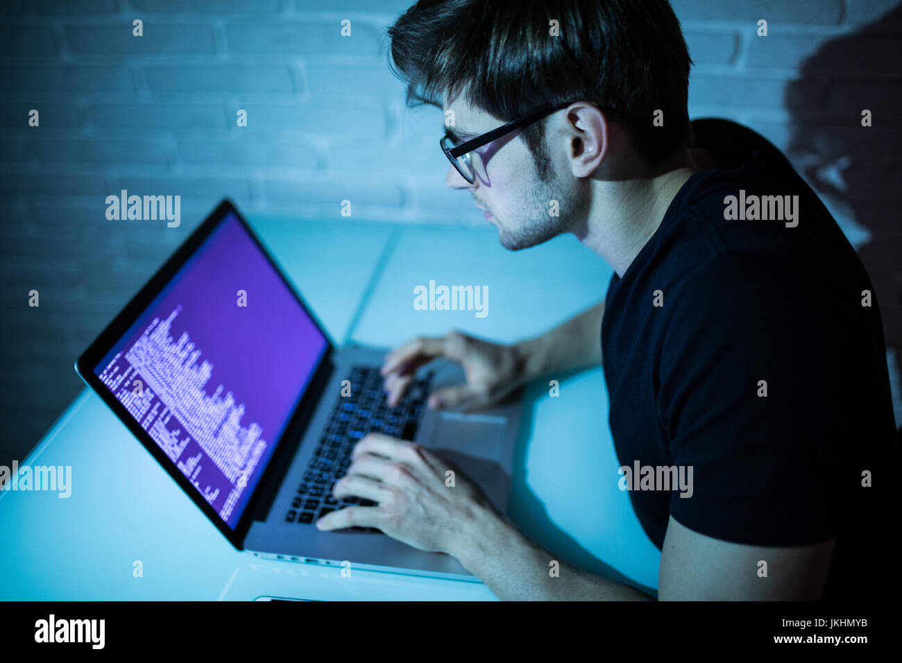 Program development concept young man working with computer Stock Photo ...