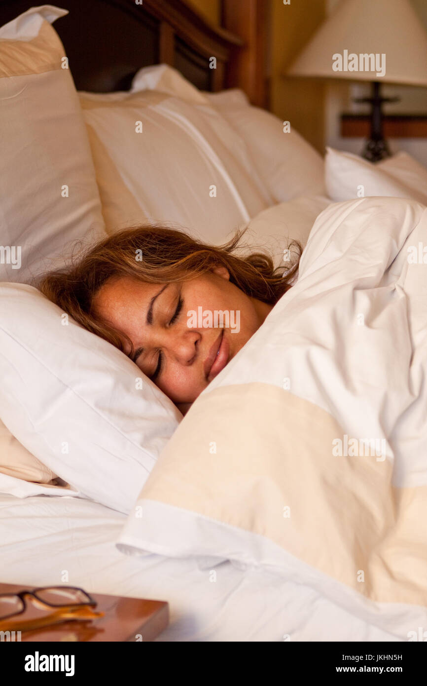 Woman getting a good nights rest Stock Photo - Alamy