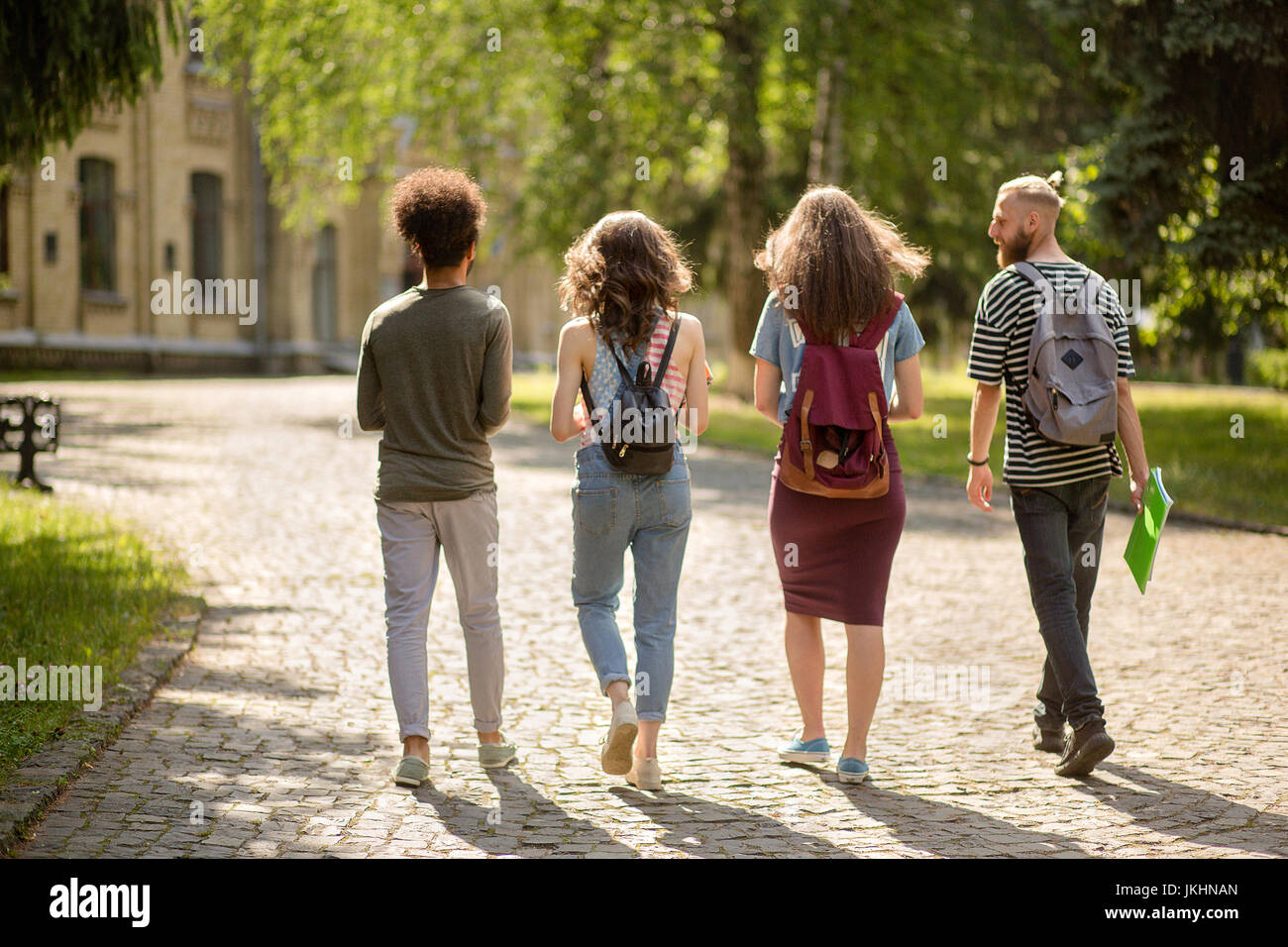 Rear view on group of students going together to college Stock Photo ...