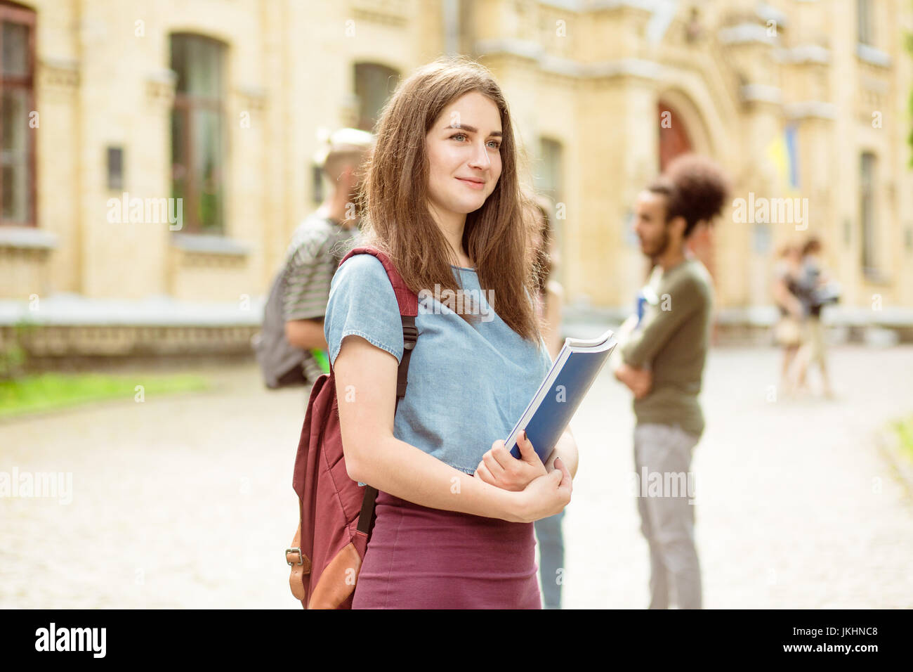 On foreground student girl with long brown hair Stock Photo - Alamy
