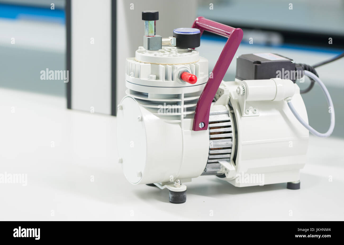 small white air compressor for science experiment Laboratory Stock ...