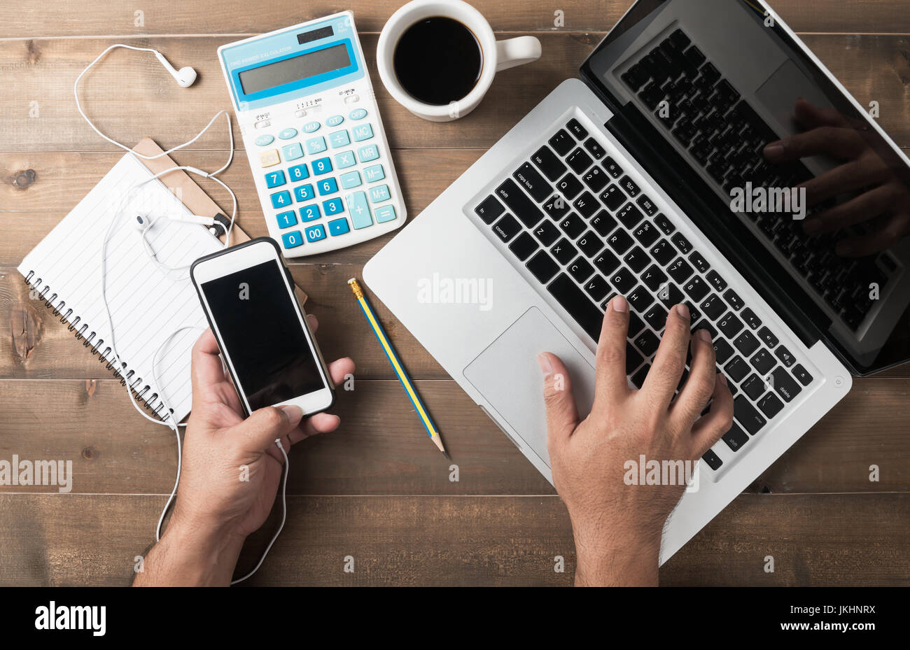 Office desk table with laptop, calculator, smartphone, pencil and ...