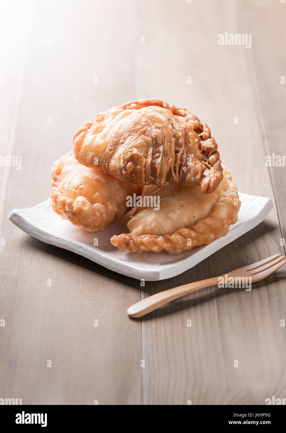 Curry puff pastry on wood background Stock Photo - Alamy