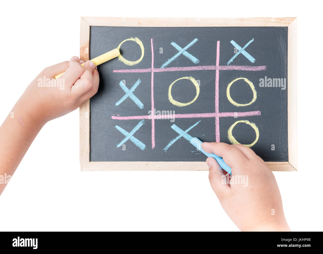 boy and girl hand drawing a game of tic tac toe on a black chalkboard ...