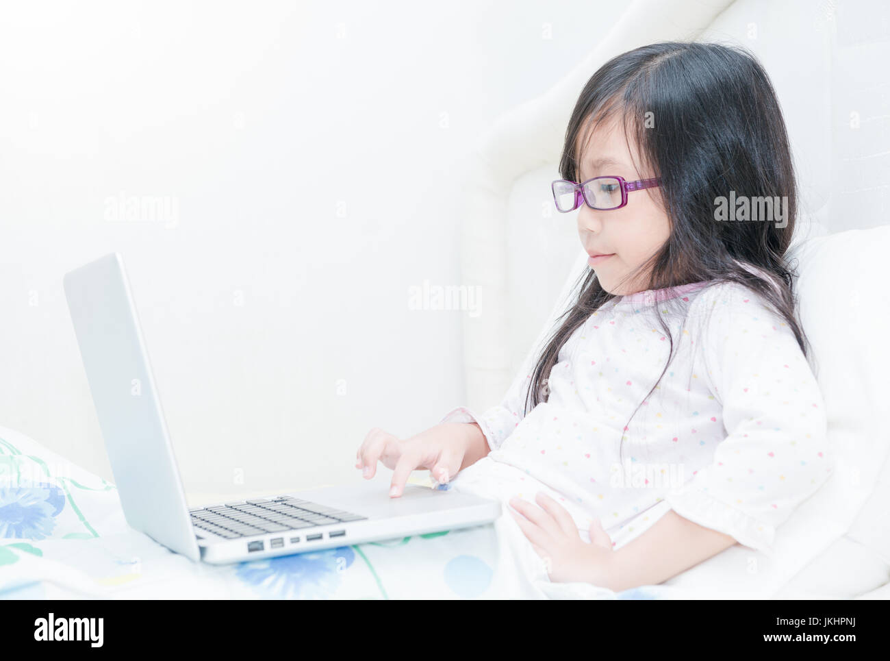Cute girl working on laptop computer concept for education, learning ...