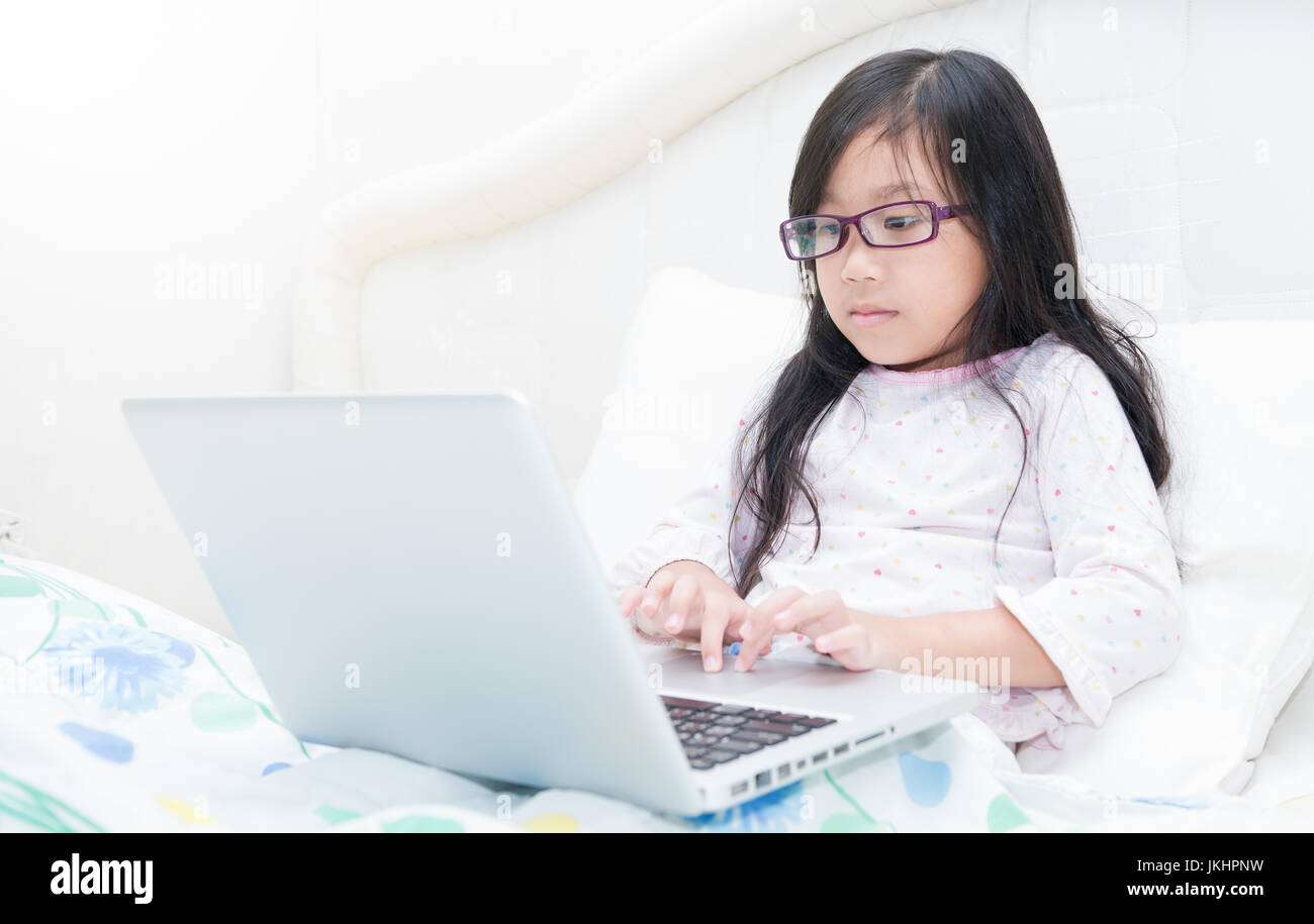 Cute girl working on laptop computer concept for education, learning ...