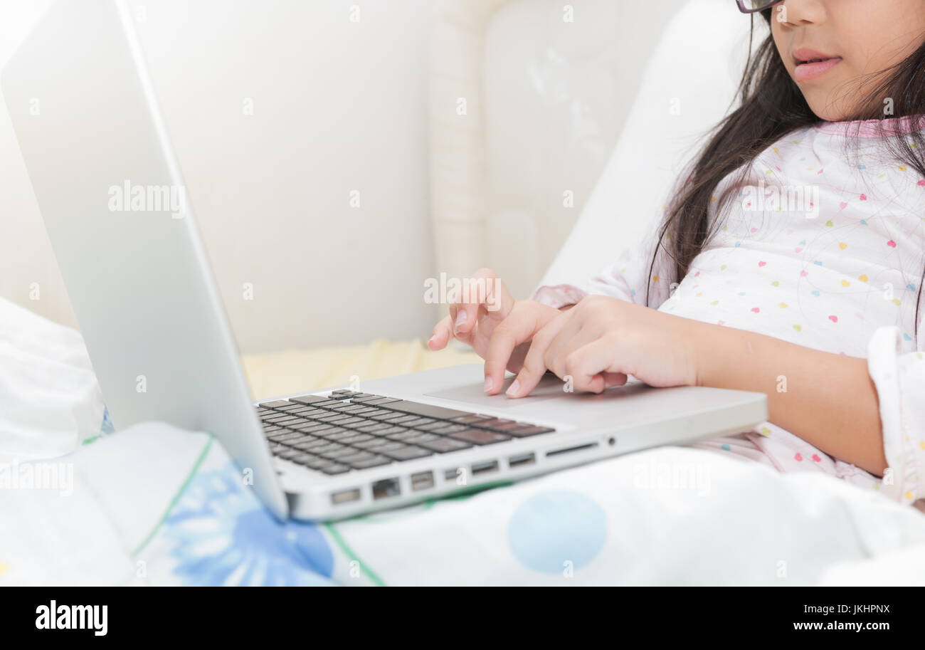 Cute girl working on laptop computer concept for education, learning ...
