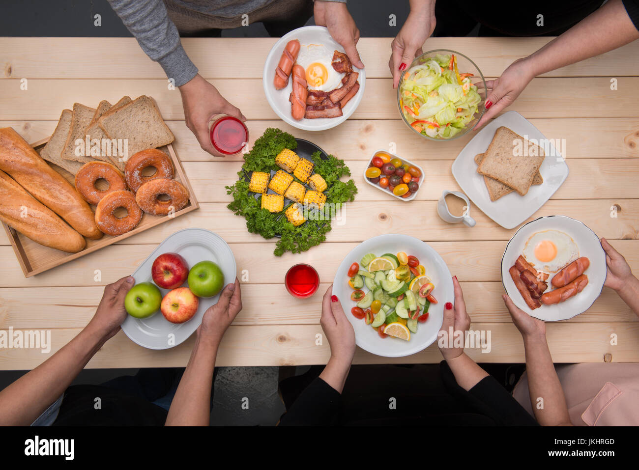 Enjoying dinner with friends. Top view of group of people having dinner ...