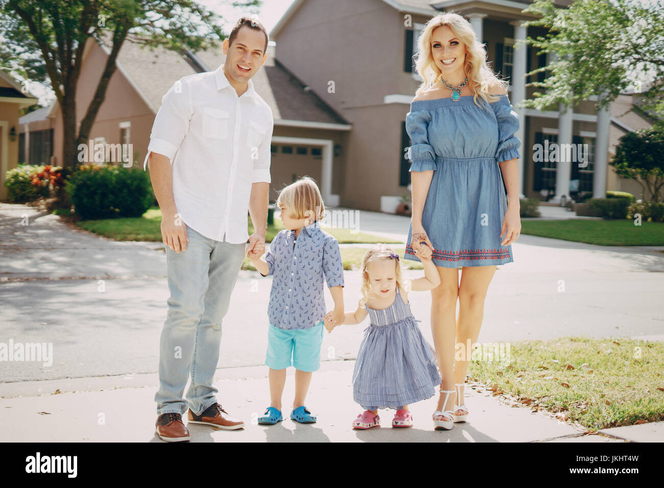 young family on the street Stock Photo - Alamy