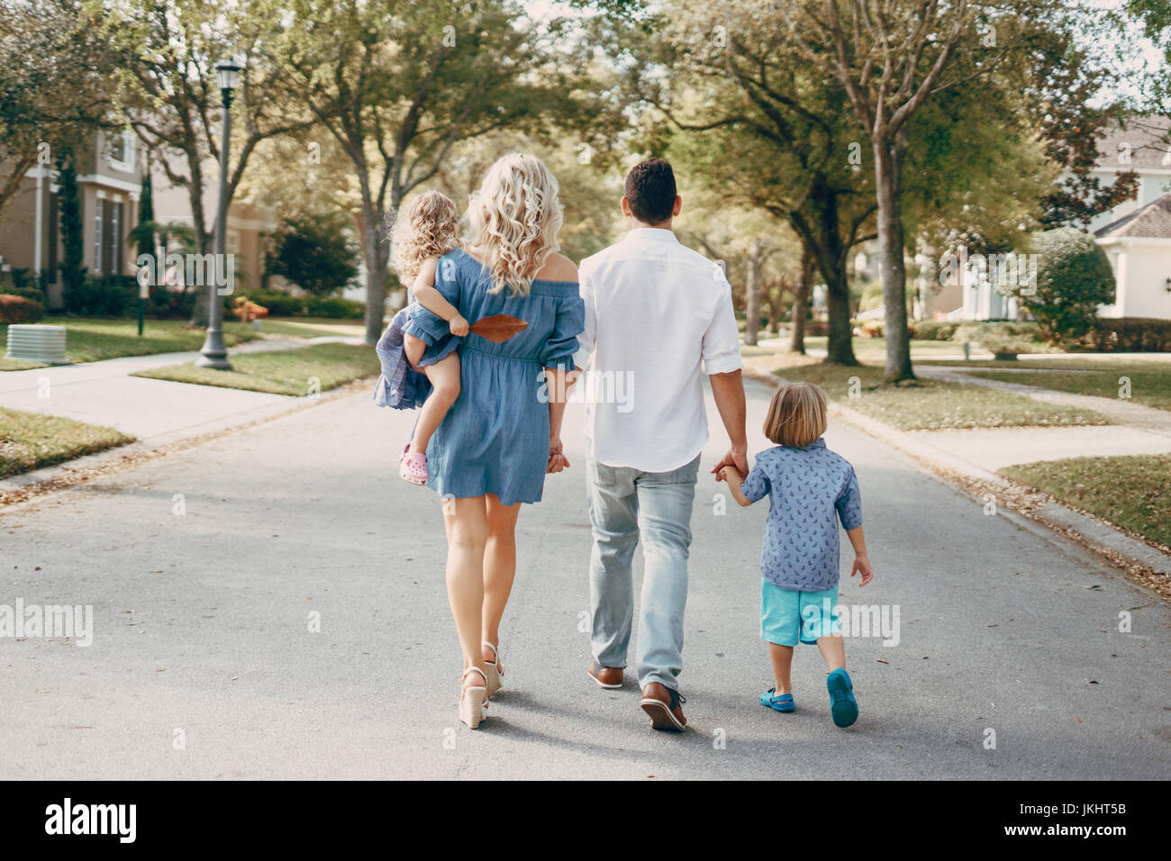 young family on the street Stock Photo - Alamy