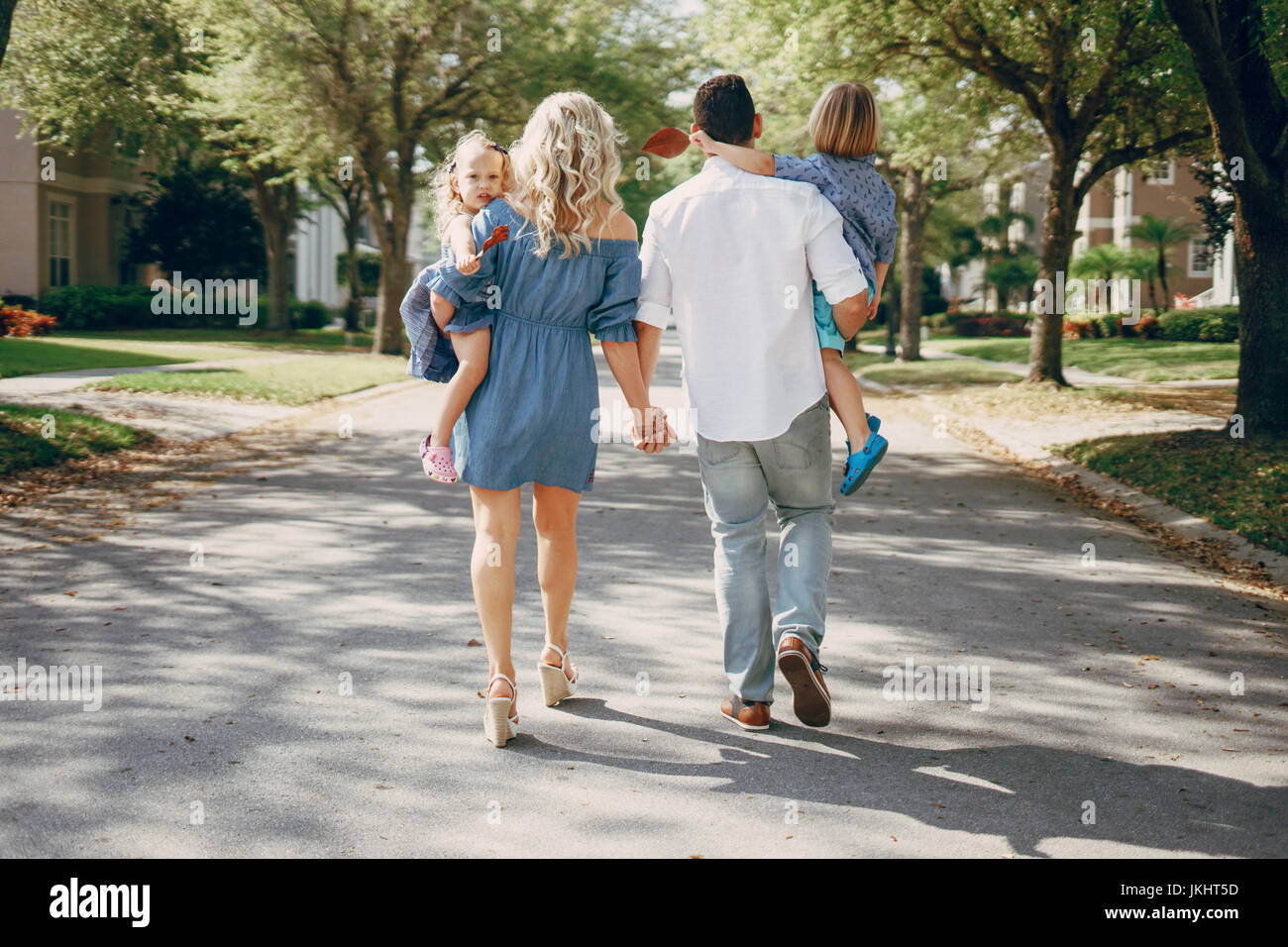 young family on the street Stock Photo - Alamy