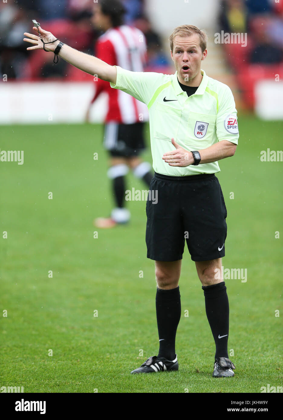 Referee Gavin Ward during the pre-season friendly match at Griffin Park ...