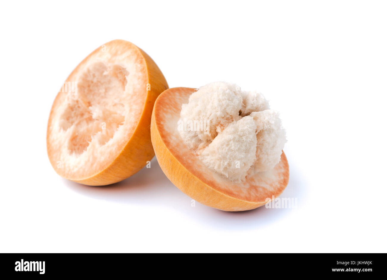 sliced santol fruit isolated on white background Stock Photo - Alamy