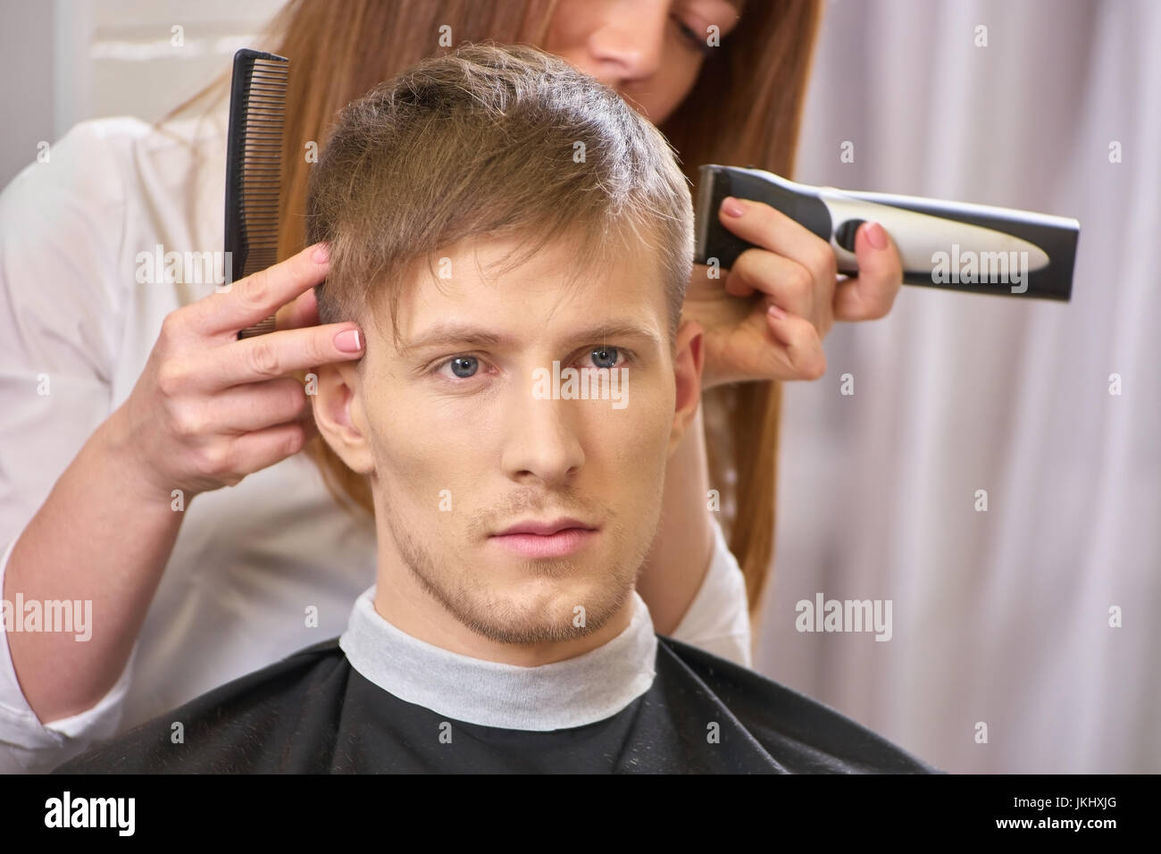 Guy in hair salon Stock Photo - Alamy
