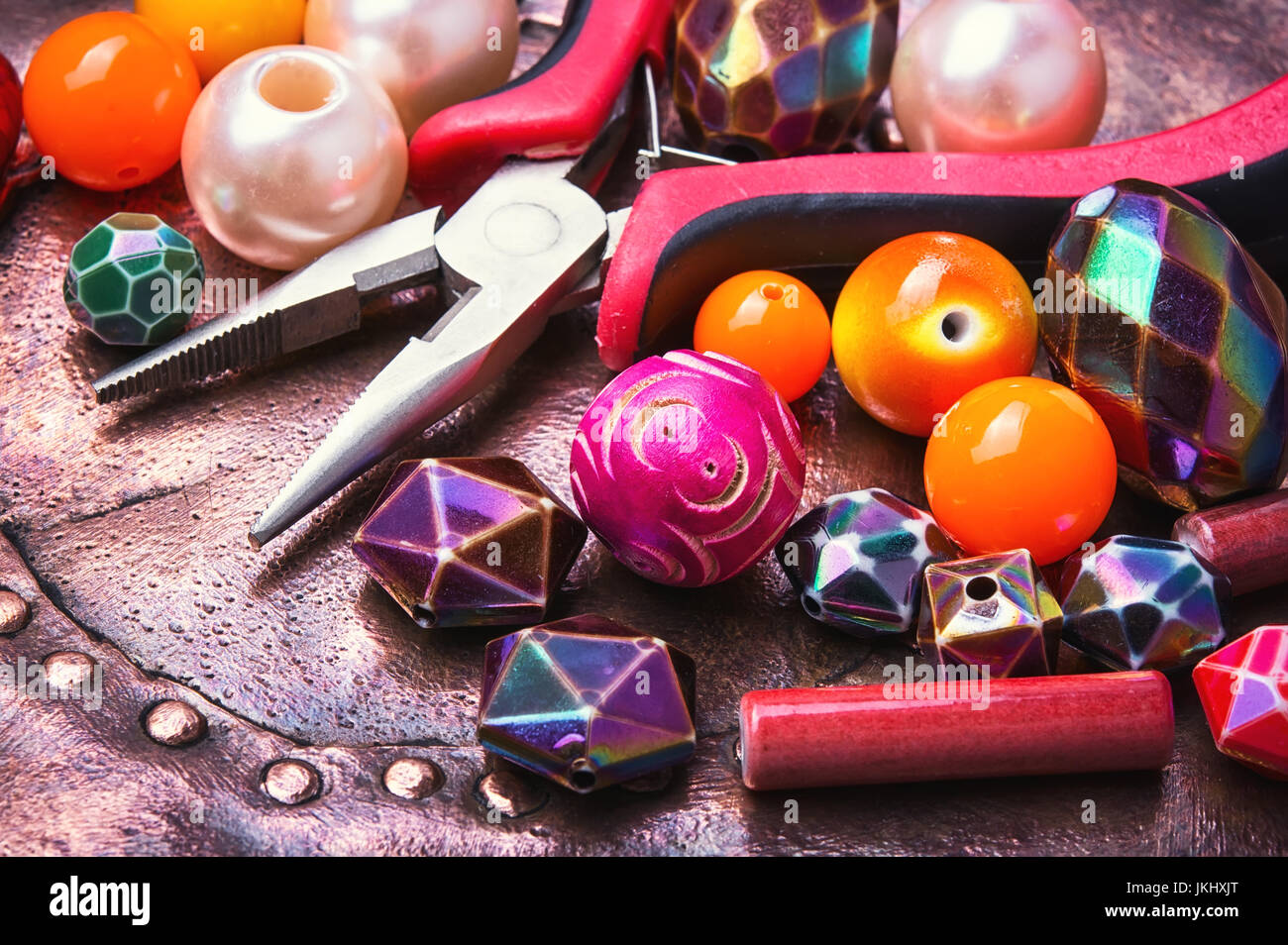 Set of bright beads for making ornaments and bijouterie Stock Photo - Alamy