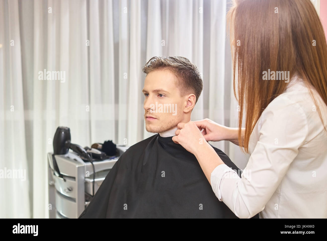 Young man in beauty salon hi-res stock photography and images - Alamy