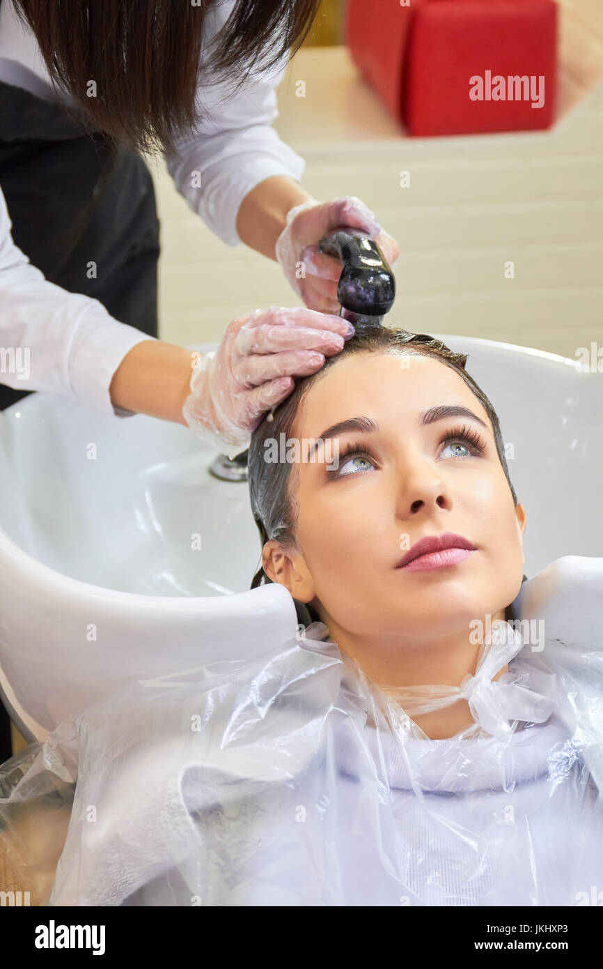 Young woman getting head washed Stock Photo - Alamy