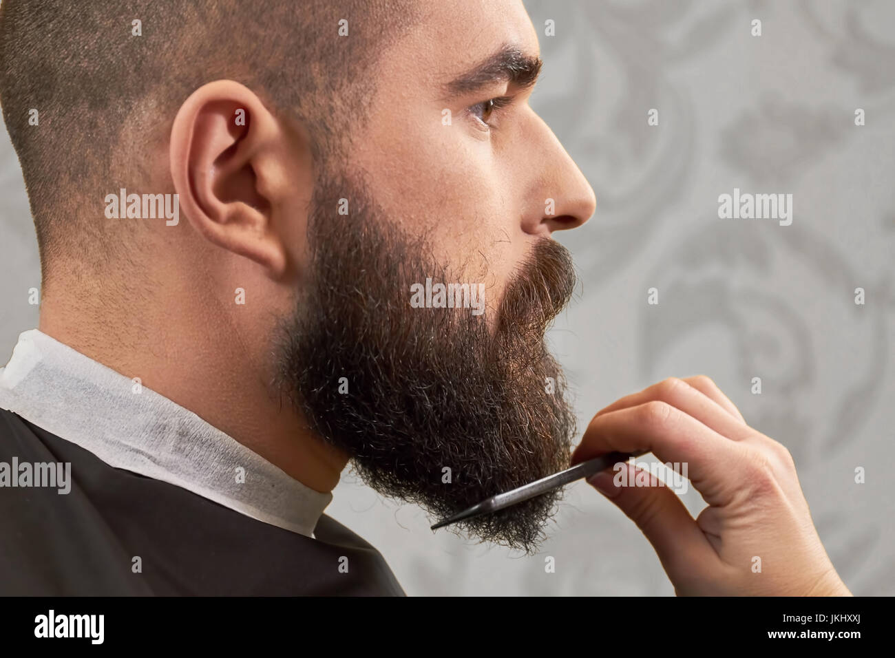 Side view of beard grooming Stock Photo - Alamy