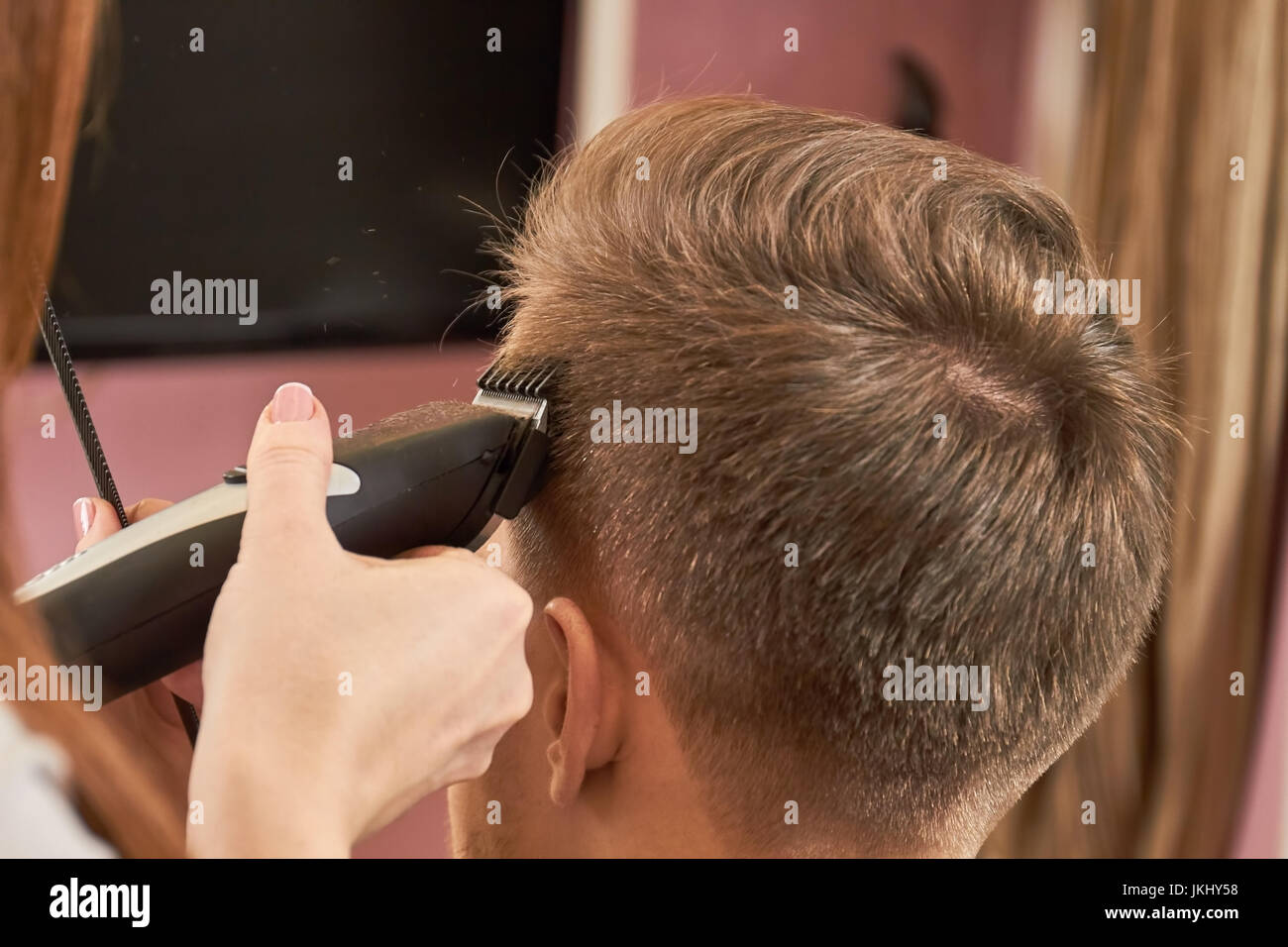 Hand of barber working, hair clipper Stock Photo - Alamy