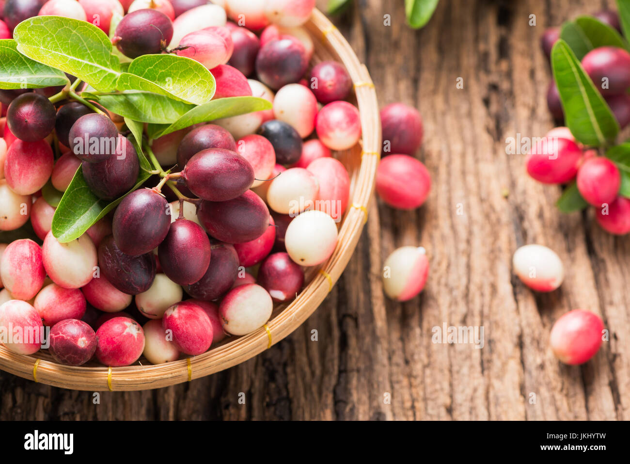 carunda fruit on old wood background, Fruit helps relieve sore throat ...