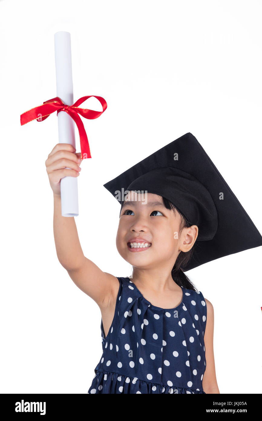 Asian Little Chinese girl wearing graduation cap and holding diploma in ...