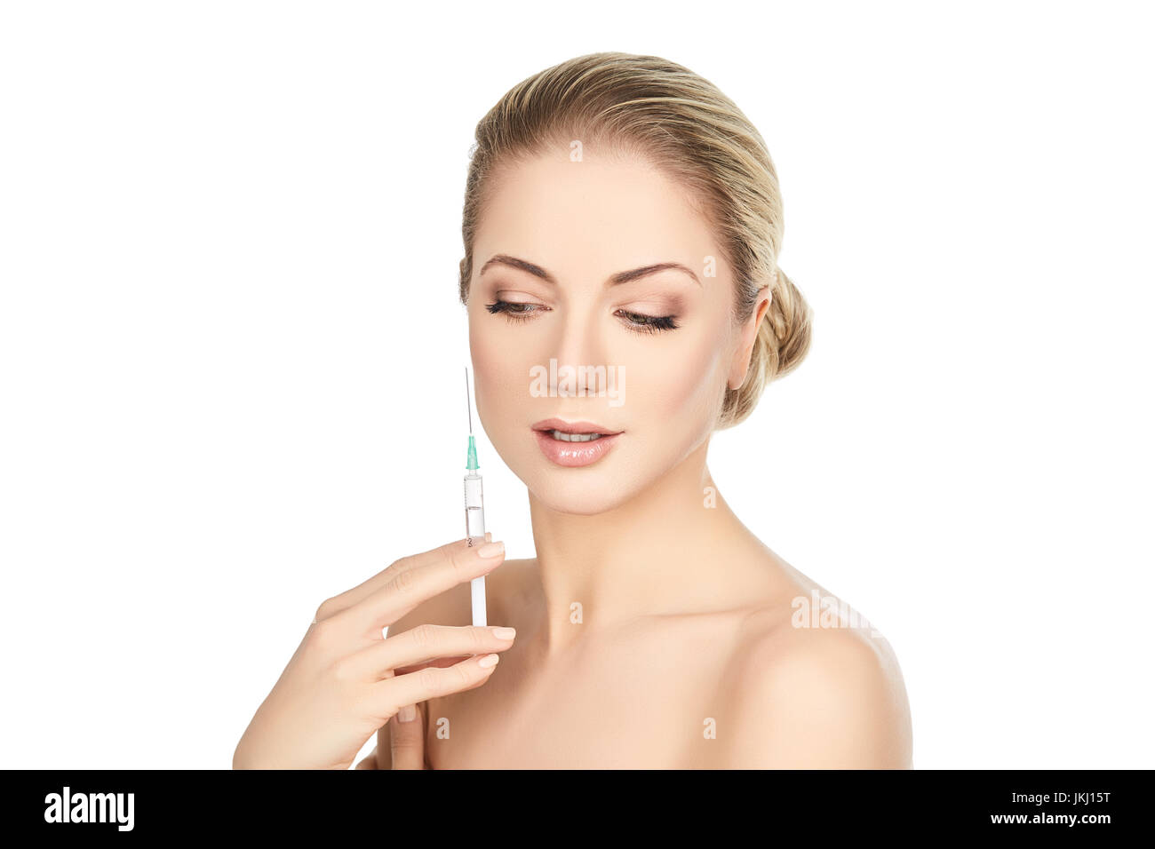 beautiful happy young woman holding syringe with collagen treatment ...