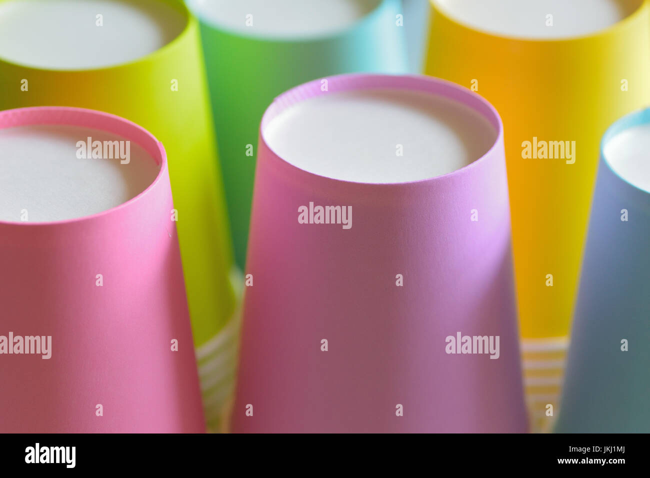 Macro details of lined up colorful paper cups in horizontal frame Stock ...