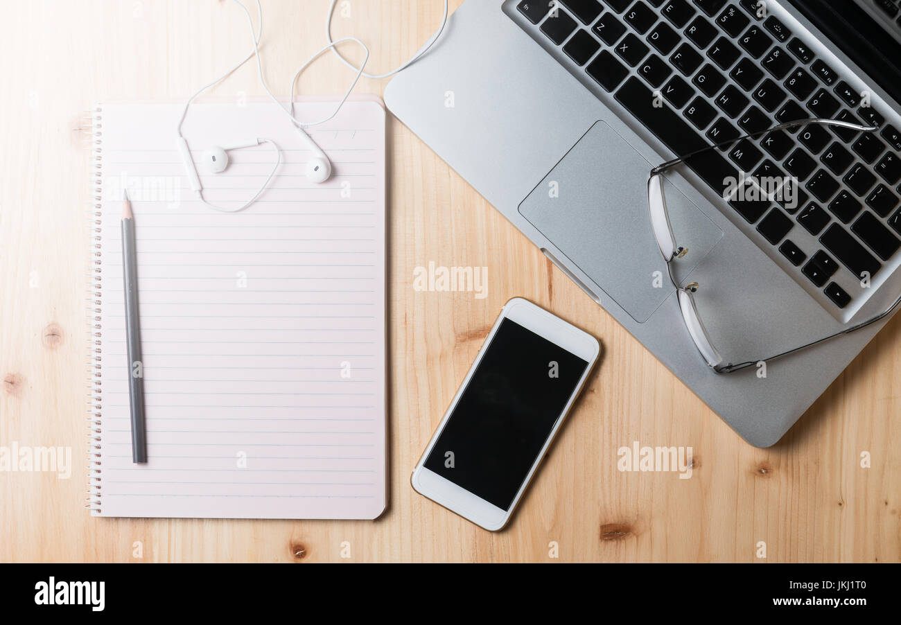 blank notebook with pencil and laptop on wood background Stock Photo ...