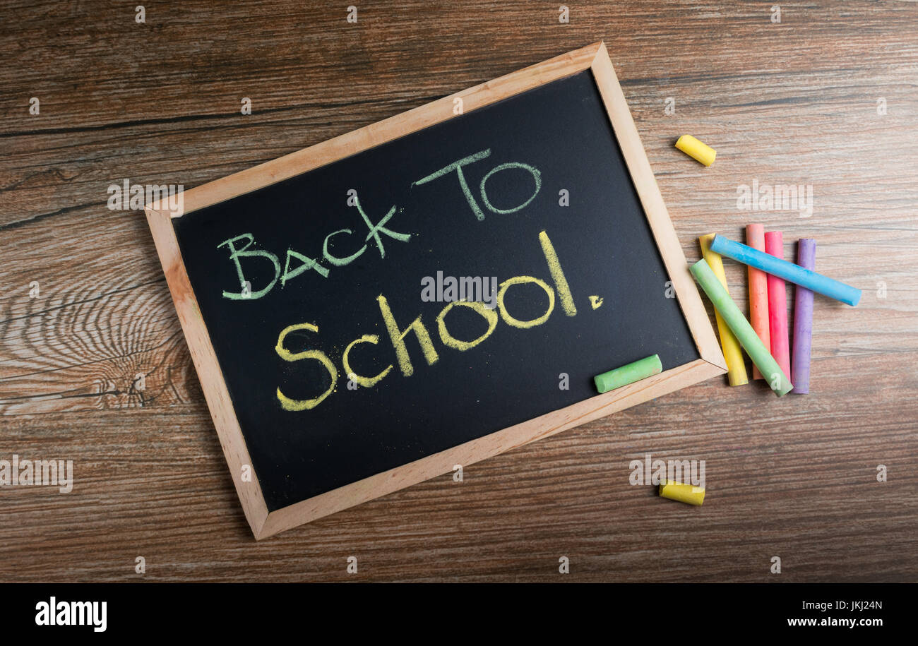 Back to school message memo reminder, chalk blackboard on wood ...