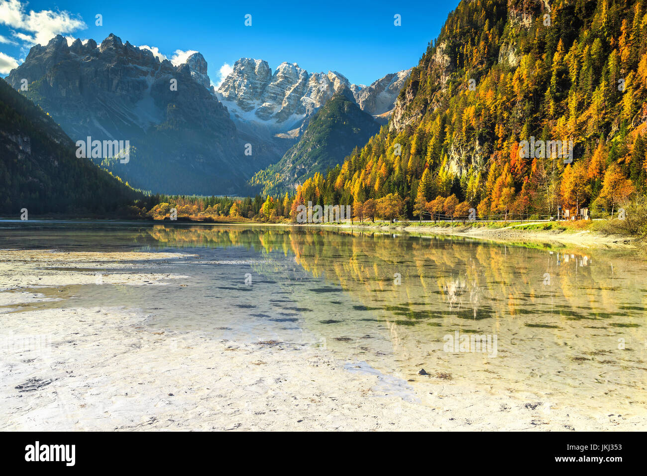 Majestic autumn landscape, alpine glacier lake and yellow pine trees ...