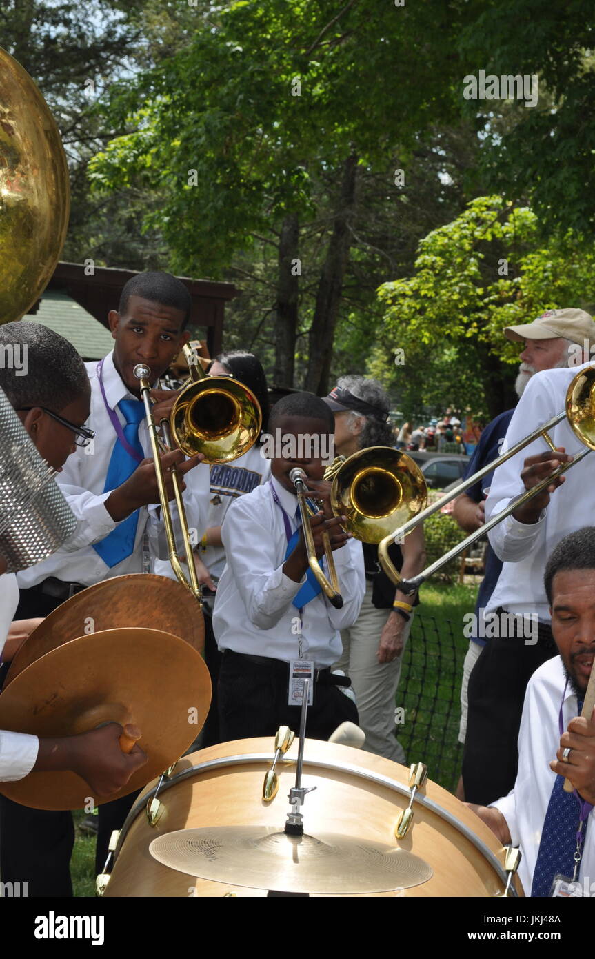 Boys playing horns at a festival Stock Photo - Alamy