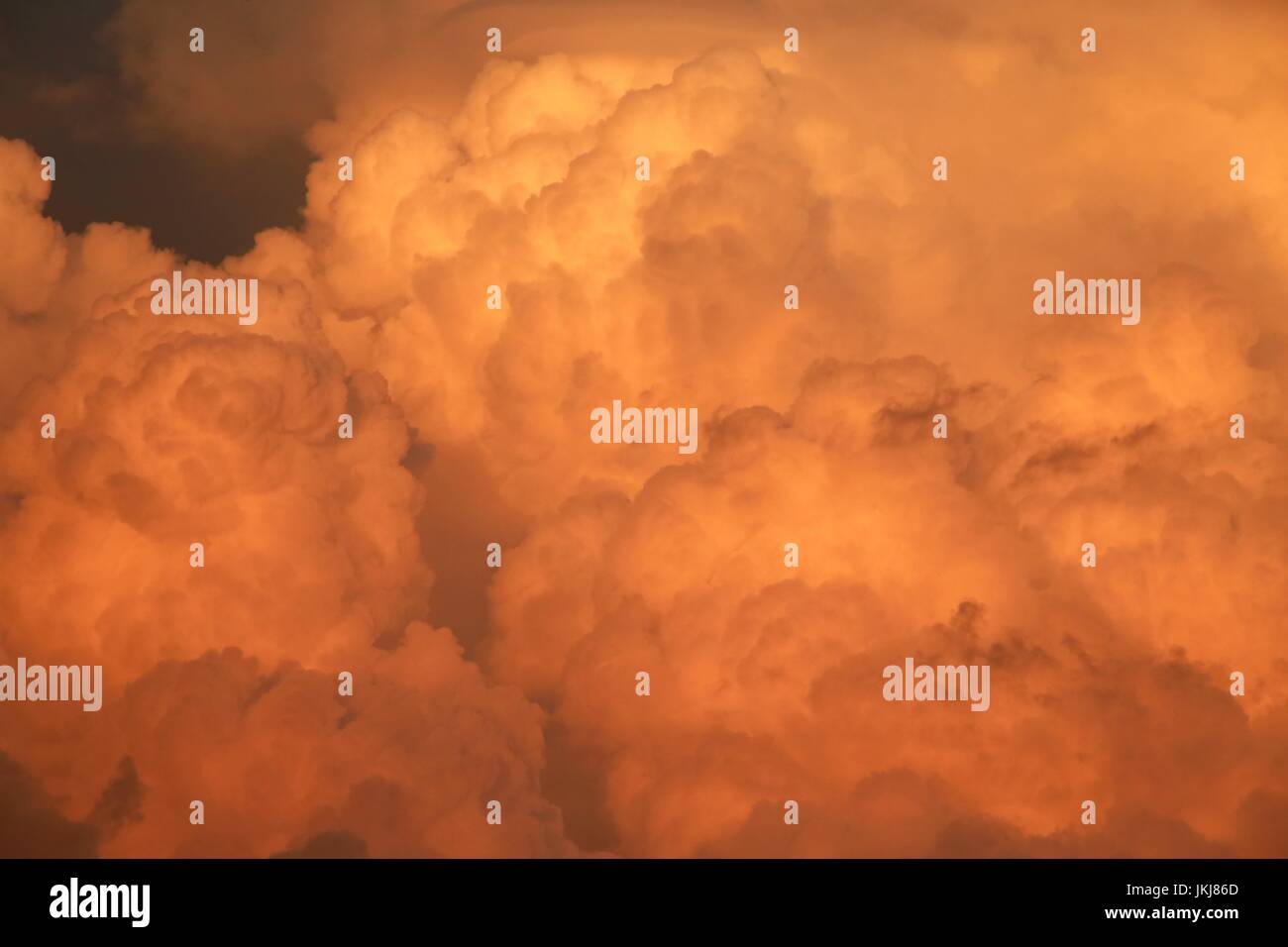 Orange Clouds in Sky at Sunset After Rain Stock Photo - Alamy