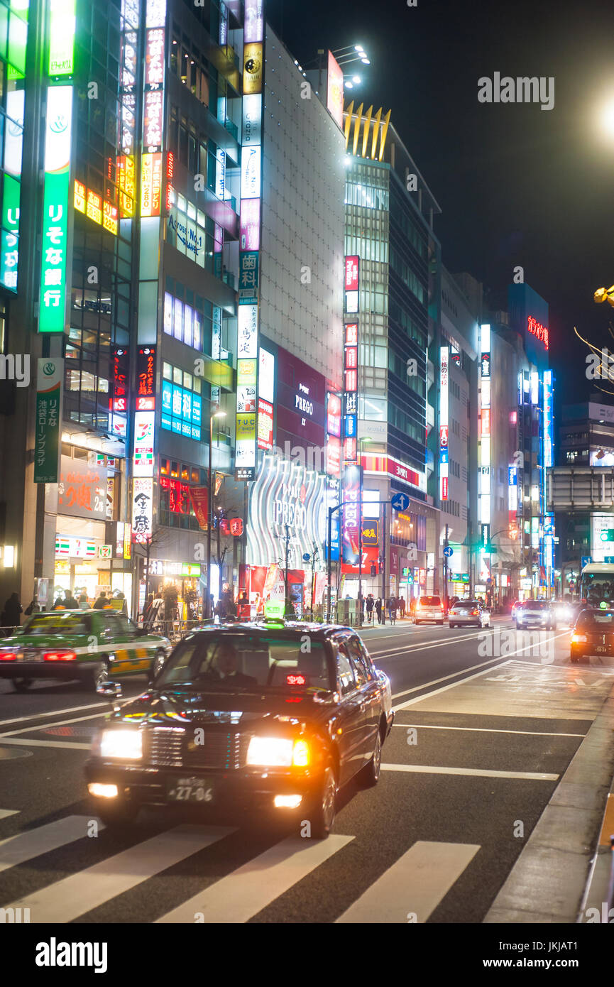 Tokyo, Japan - A street scene at night in Ikebukuru district Stock ...