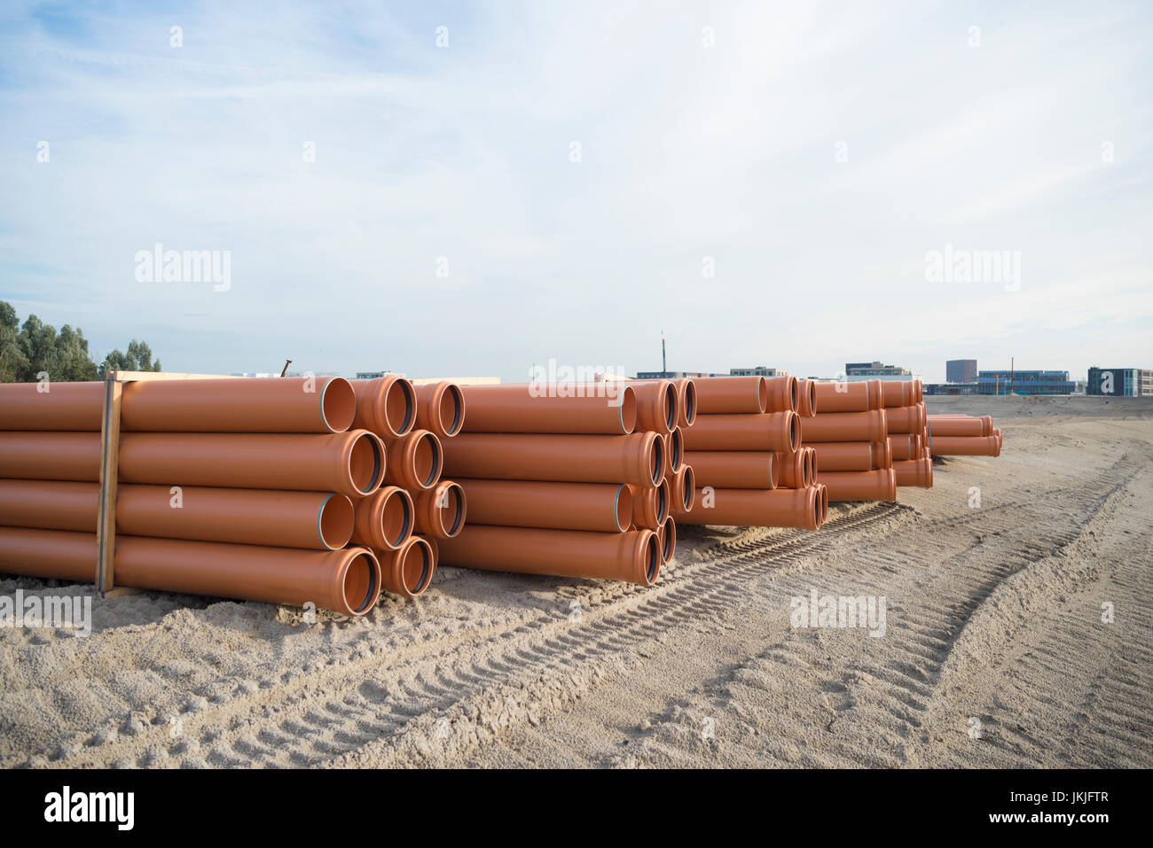 stack of pvc pipes on a construction site Stock Photo - Alamy
