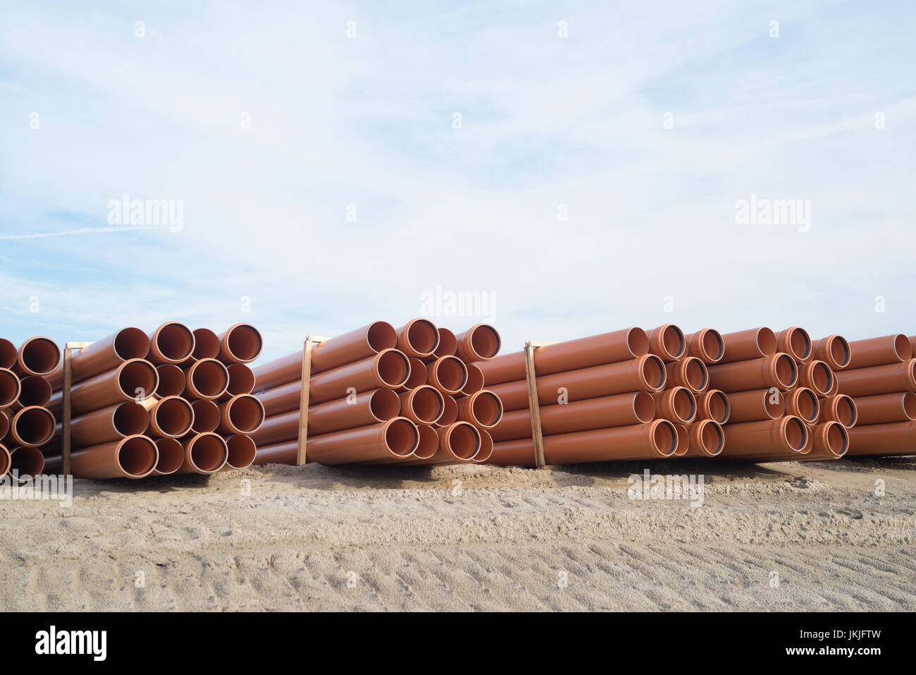 stack of pvc pipes on a construction site Stock Photo - Alamy