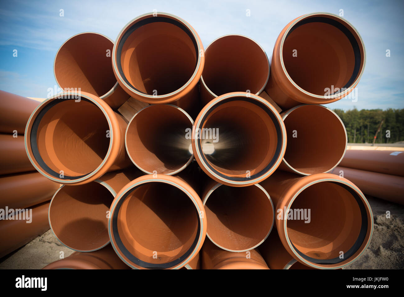 stack of pvc pipes on a construction site Stock Photo - Alamy