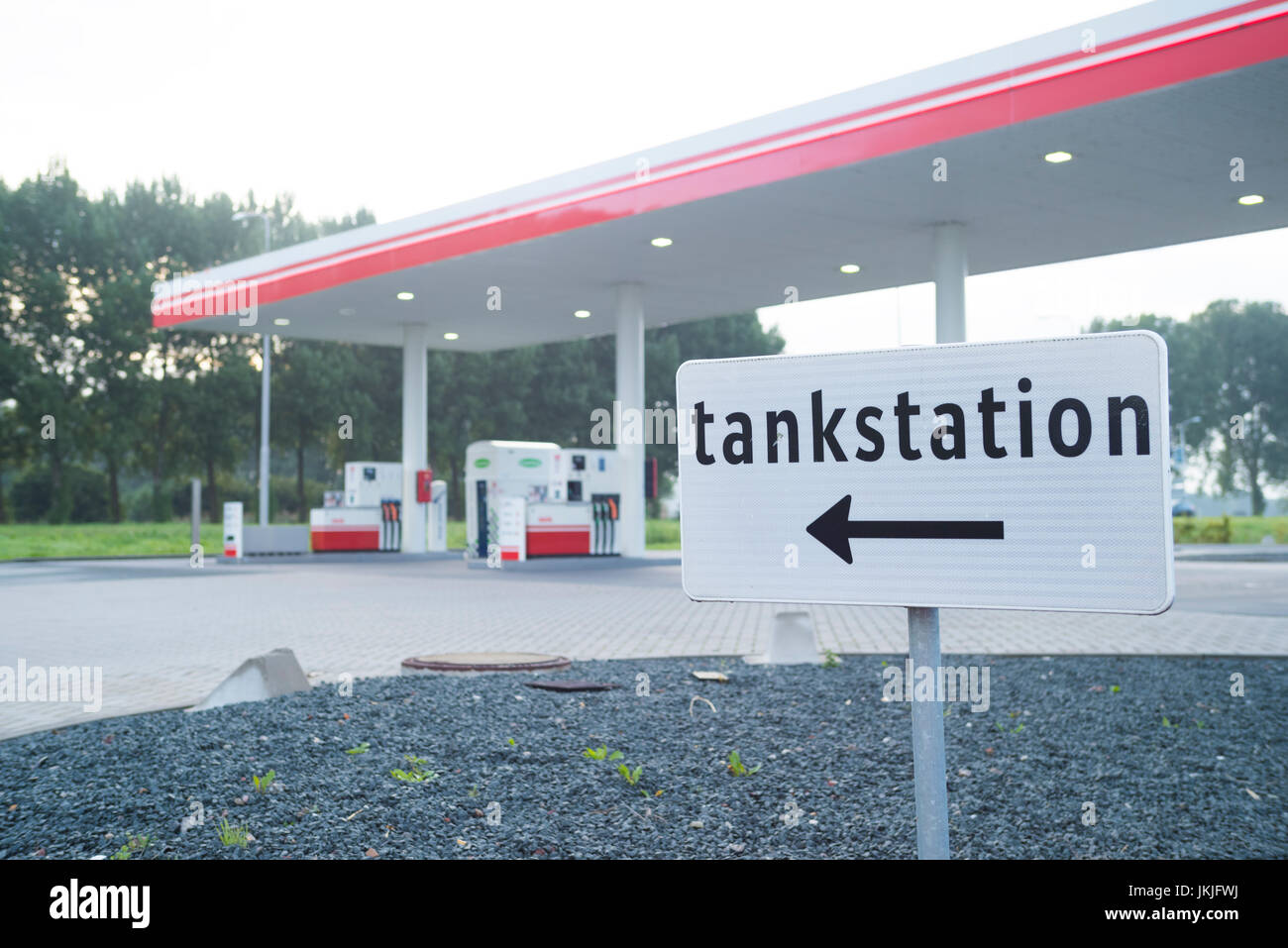direction shield in front of an unmanned gas station in the netherlands ...