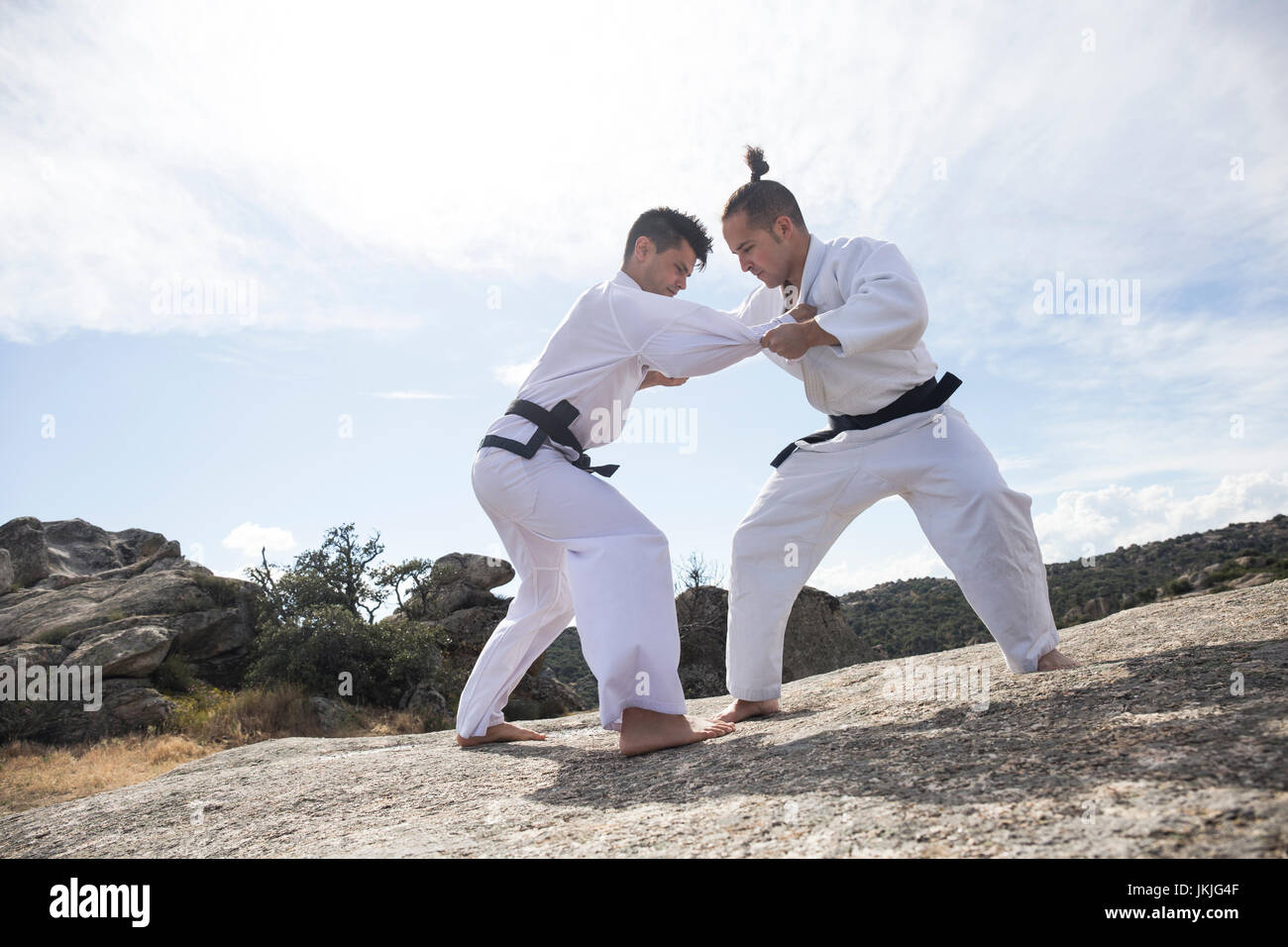 Men doing combat exercises during a martial arts training Stock Photo ...