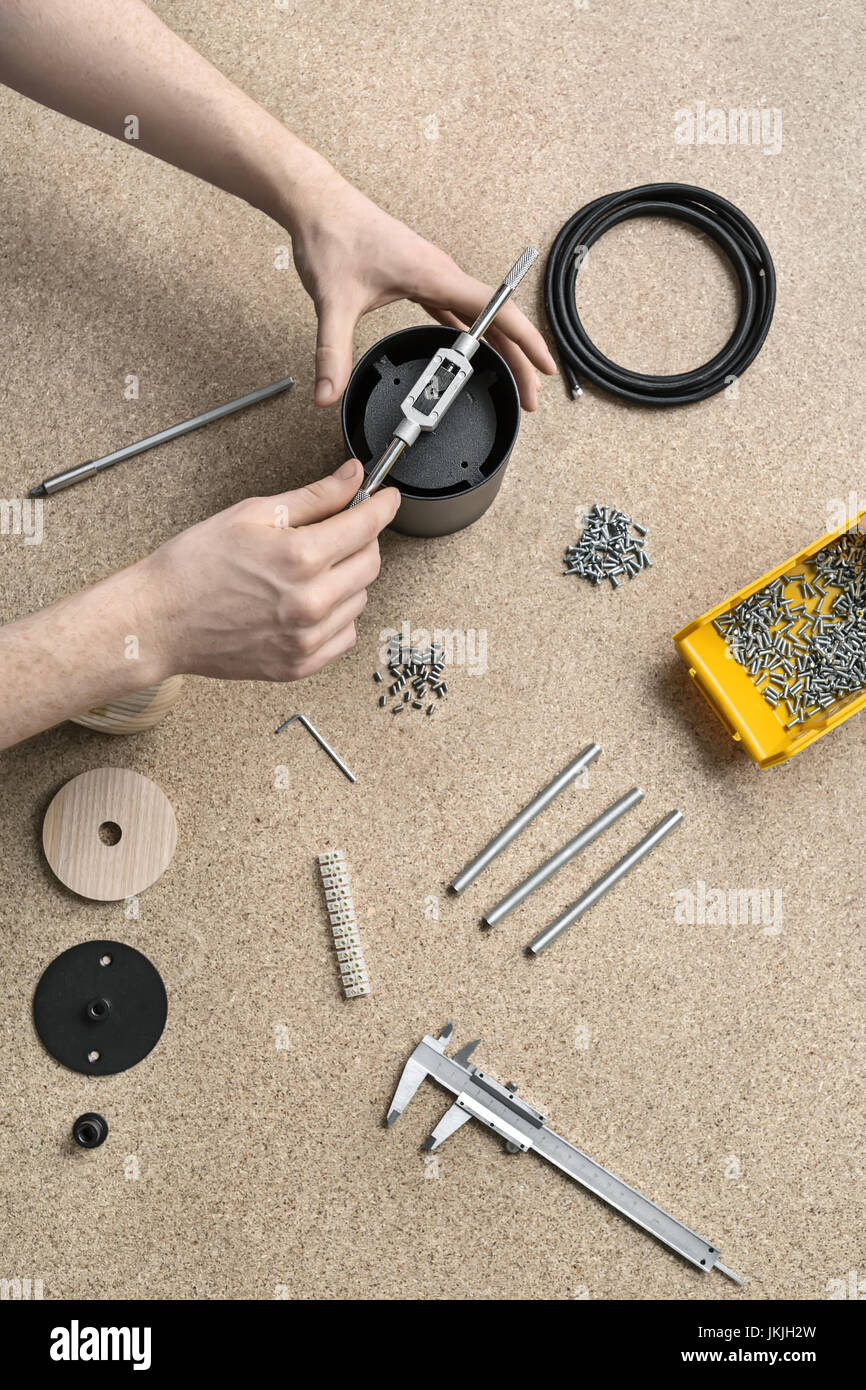 Guy using wrench in workshop Stock Photo - Alamy