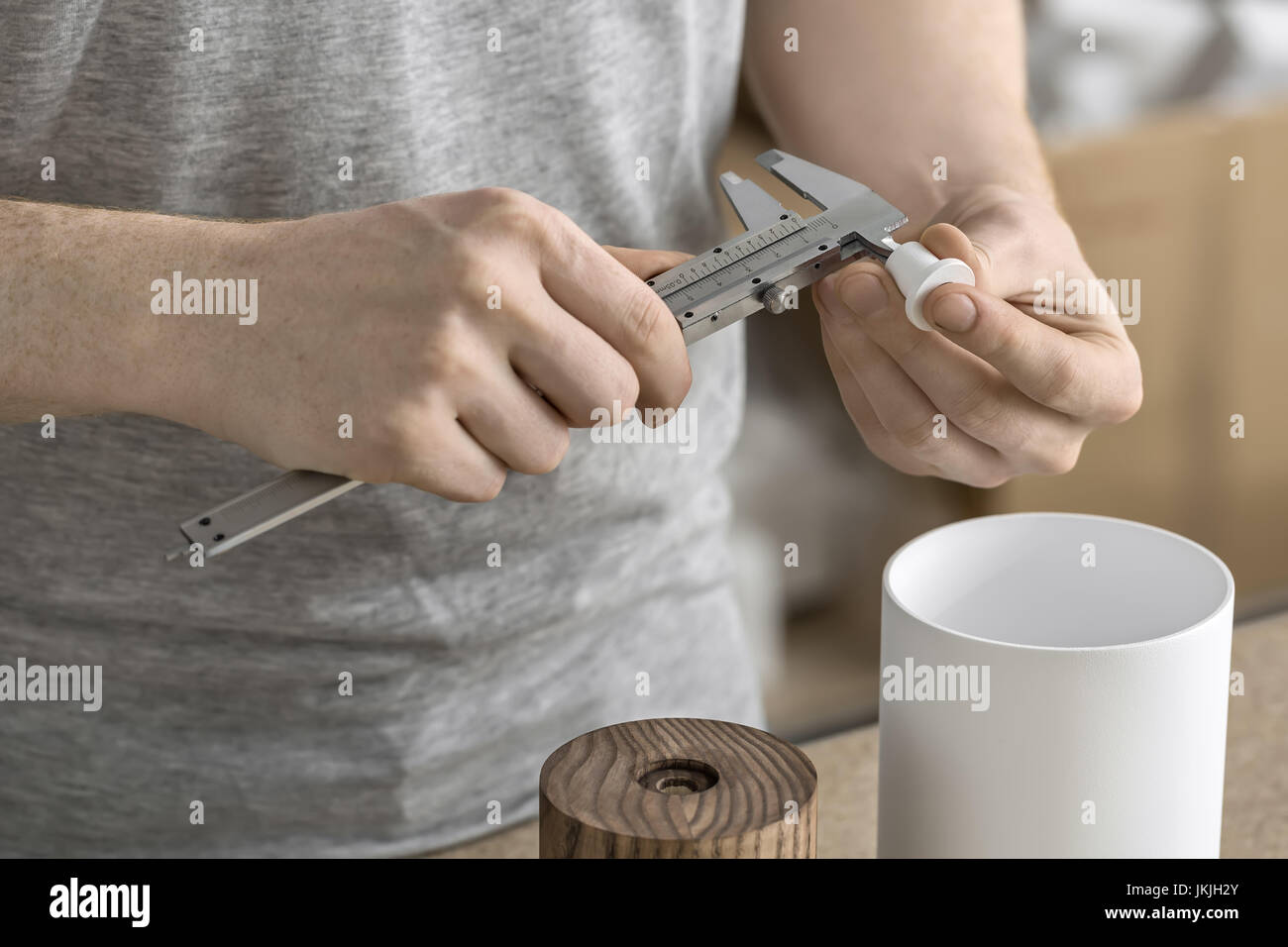 Man using caliper in workshop Stock Photo - Alamy