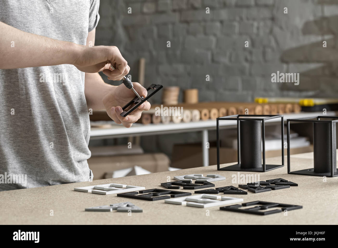 Man using wrench in workshop Stock Photo - Alamy