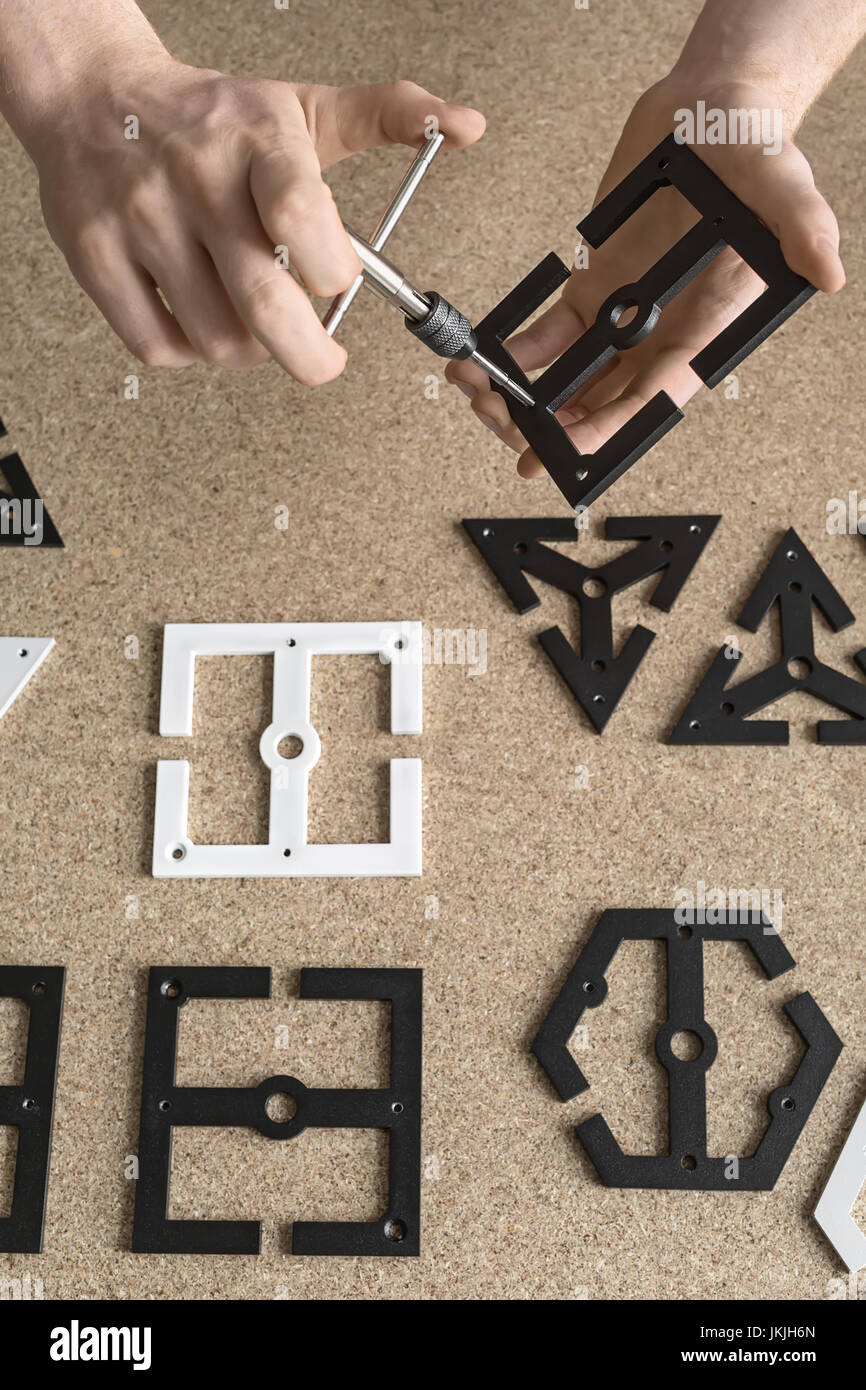 Man using wrench on billet Stock Photo - Alamy