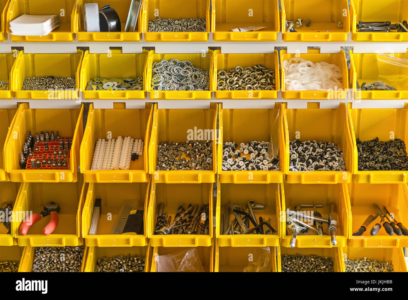 Plastic yellow boxes with instruments on wall Stock Photo - Alamy