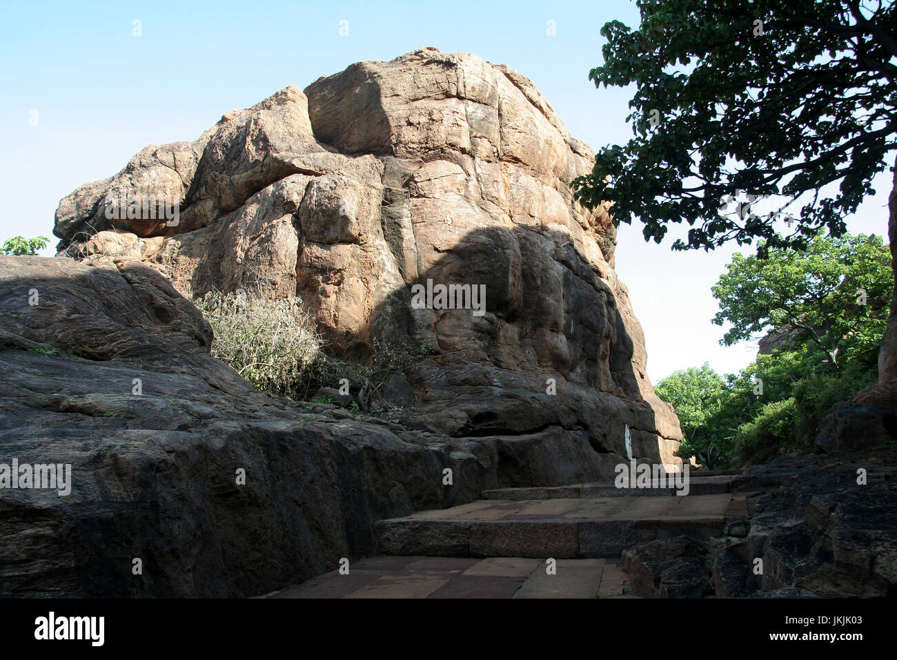Rock by the side of stone pavement on northern hill at Badami ...