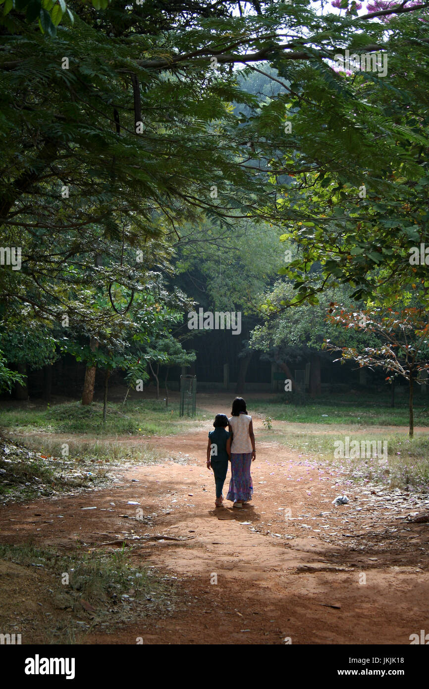Two Indian girls having morning stroll in a park Stock Photo - Alamy