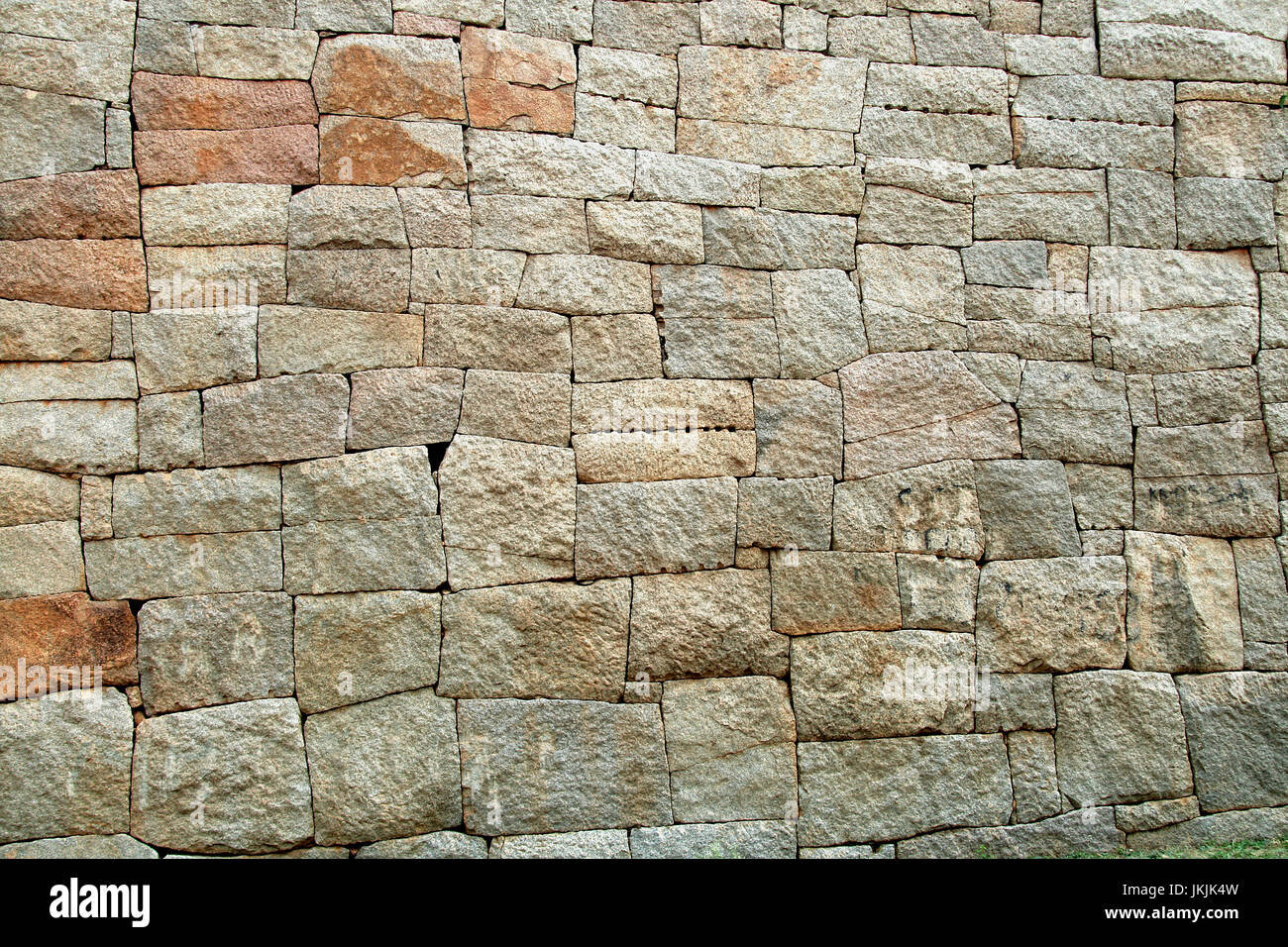 Pattern of stone wall built with dressed slabs without using any mortar ...