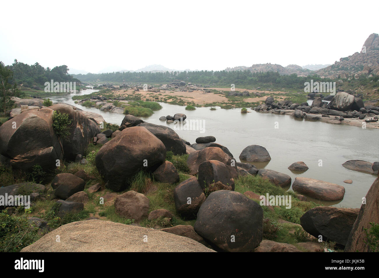 Tungabhadra River flowing through rocky terrain at Hampi, Karnataka ...