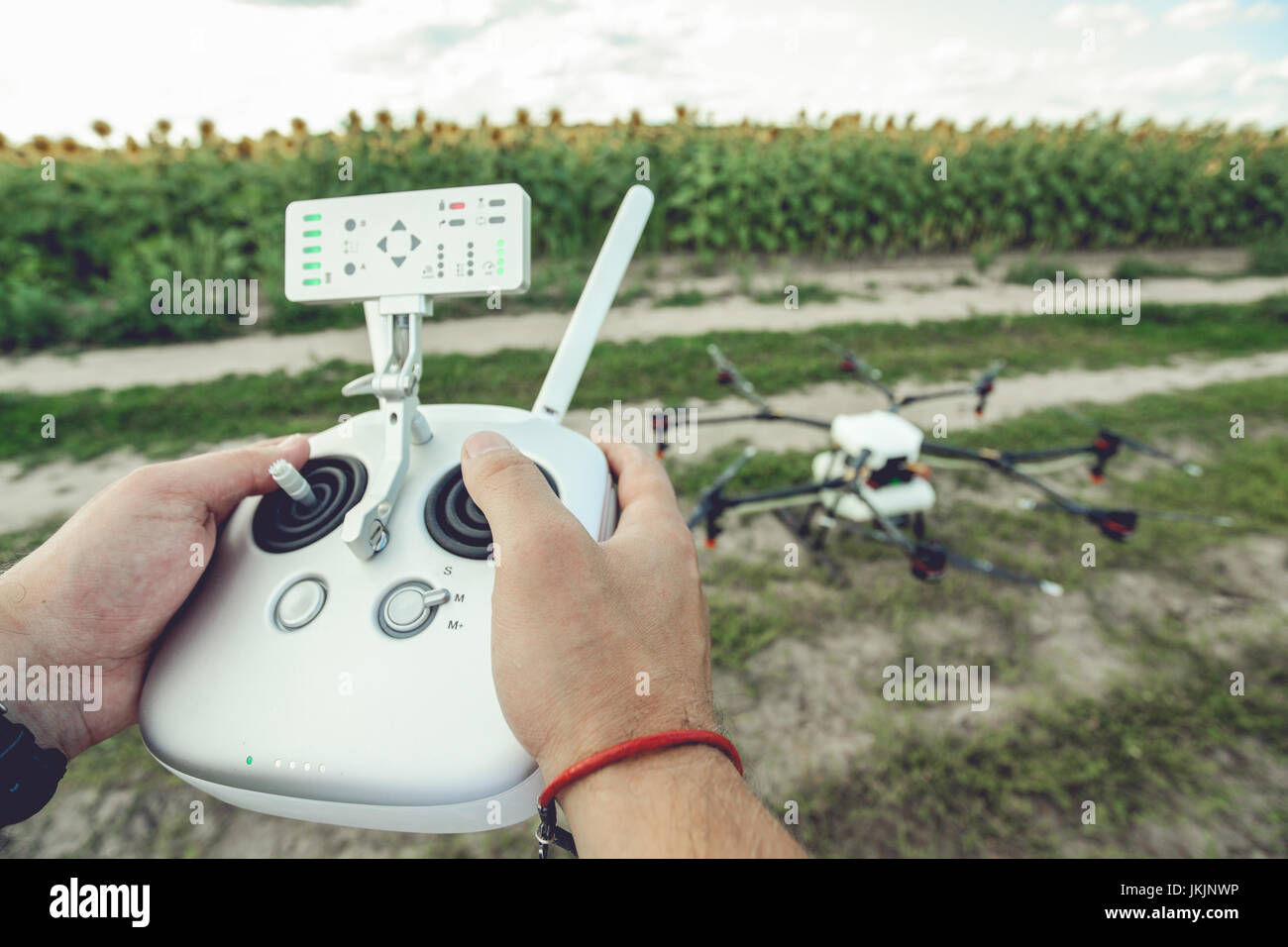 Person using remote control hi-res stock photography and images - Alamy
